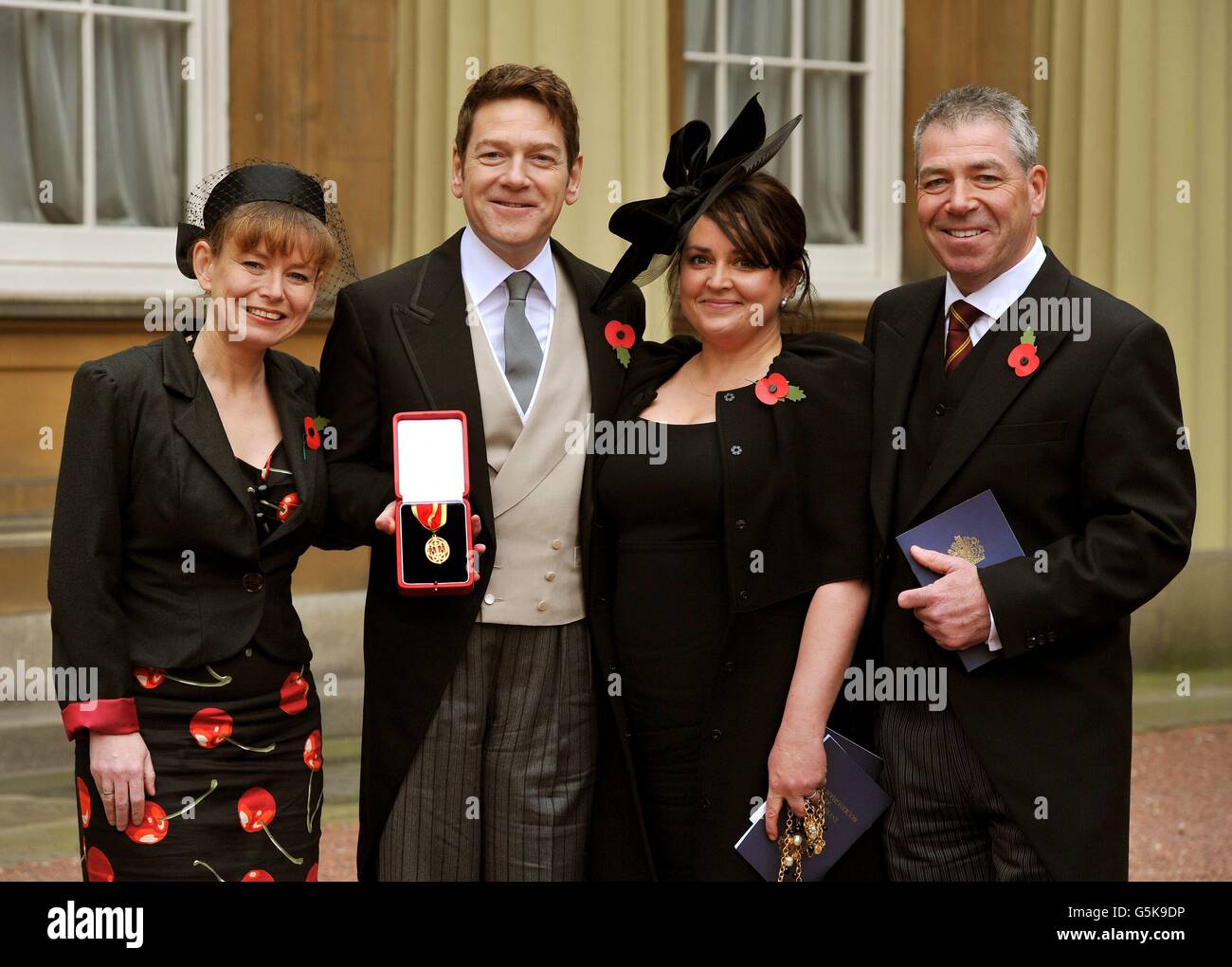Actor Kenneth Branagh poses with his award alongside his wife Lindsay ...