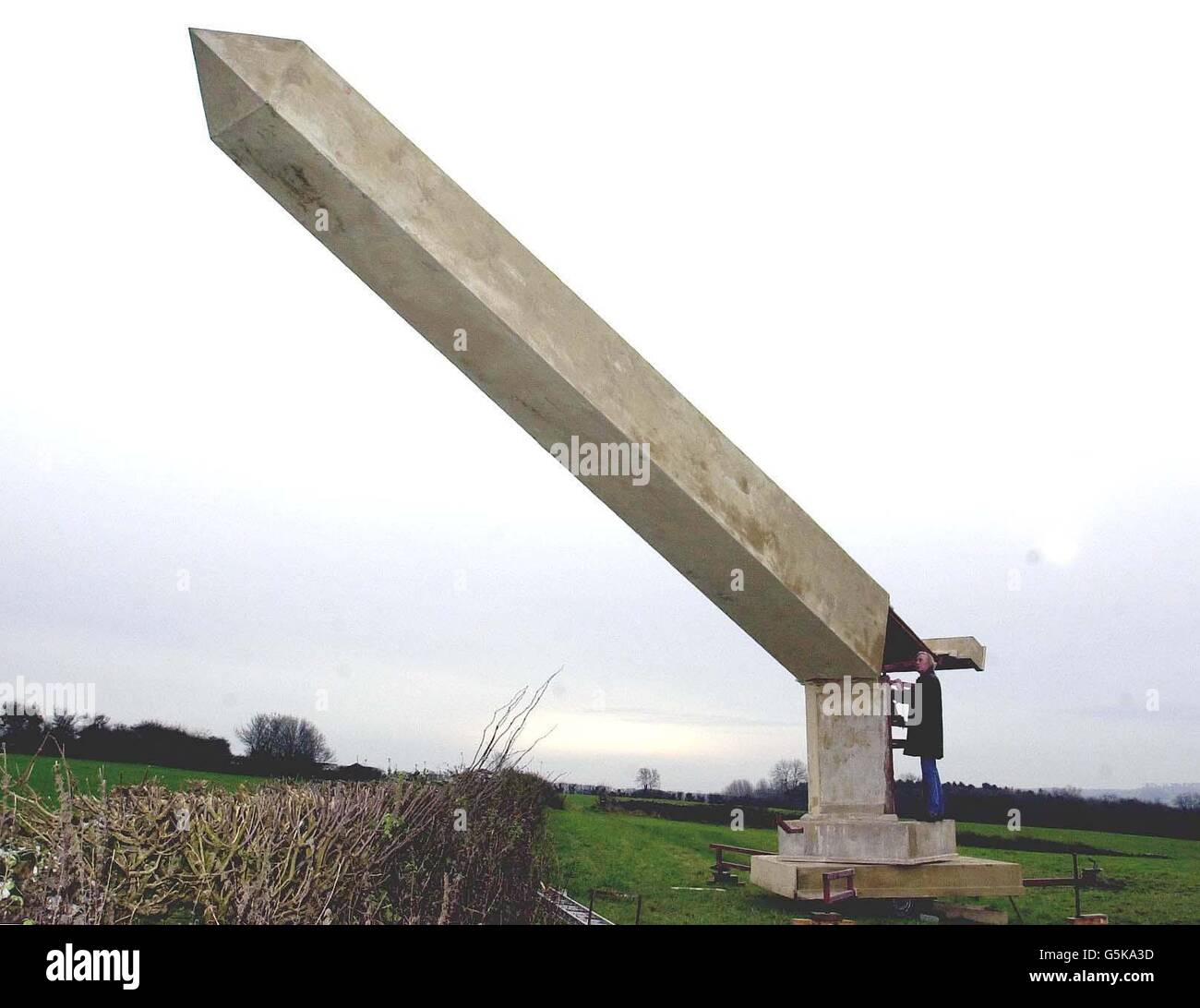 Roger Franklin, with his creation partialy erected in his back garden ...