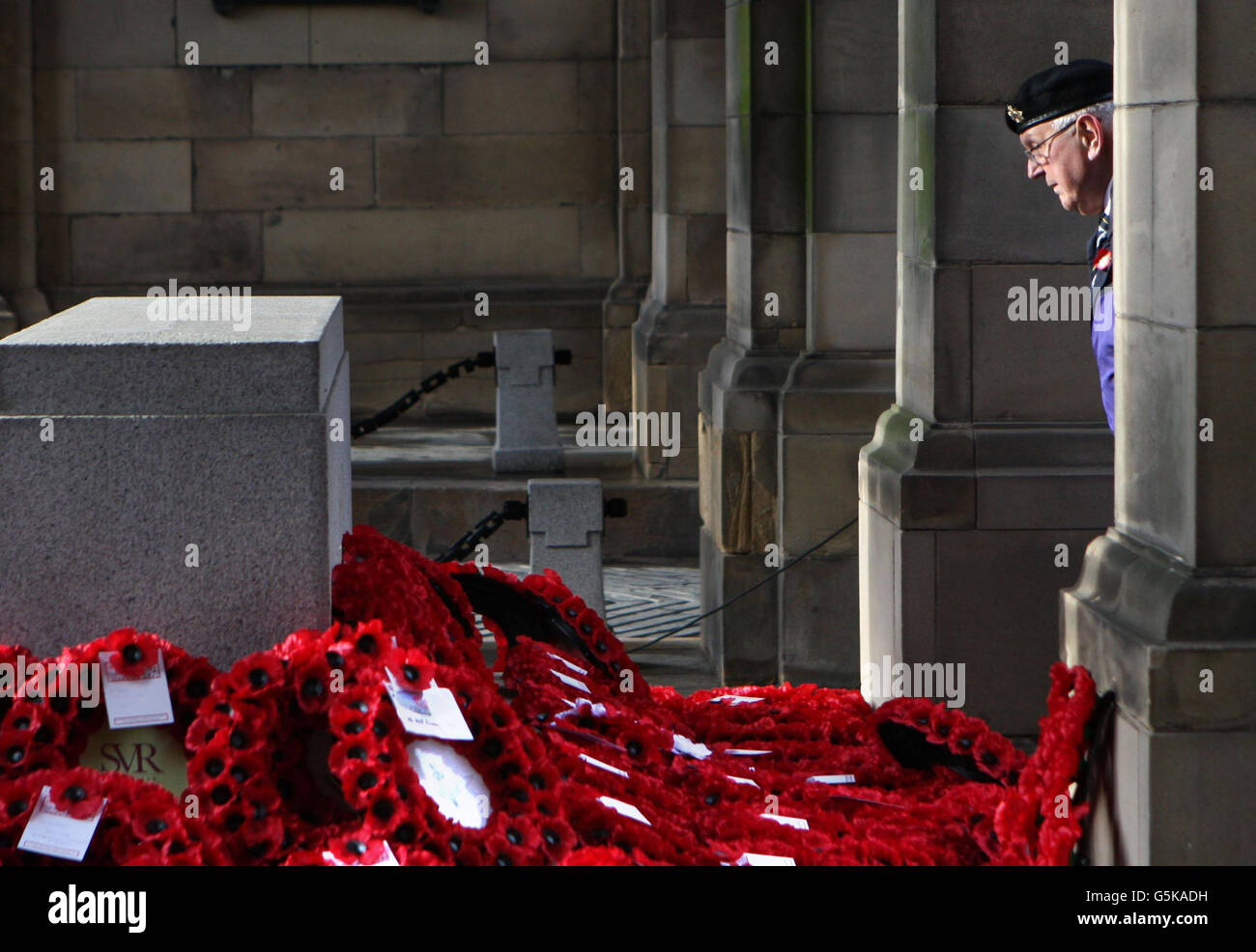 An ex-serviceman looks at the wreaths laid after Scotland's national ...