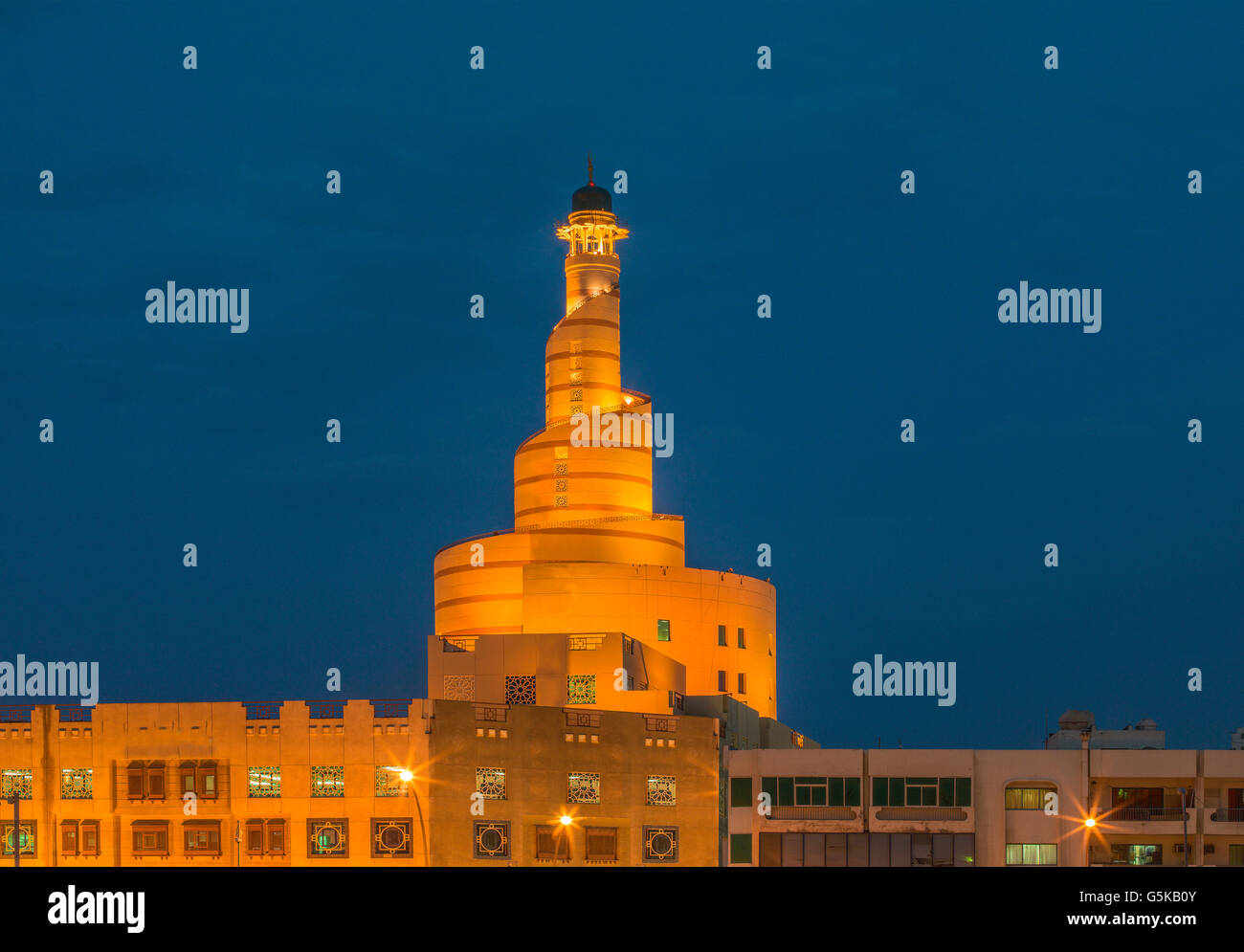 Islamic Cultural Center spire illuminated at night, Doha, Qatar Stock ...