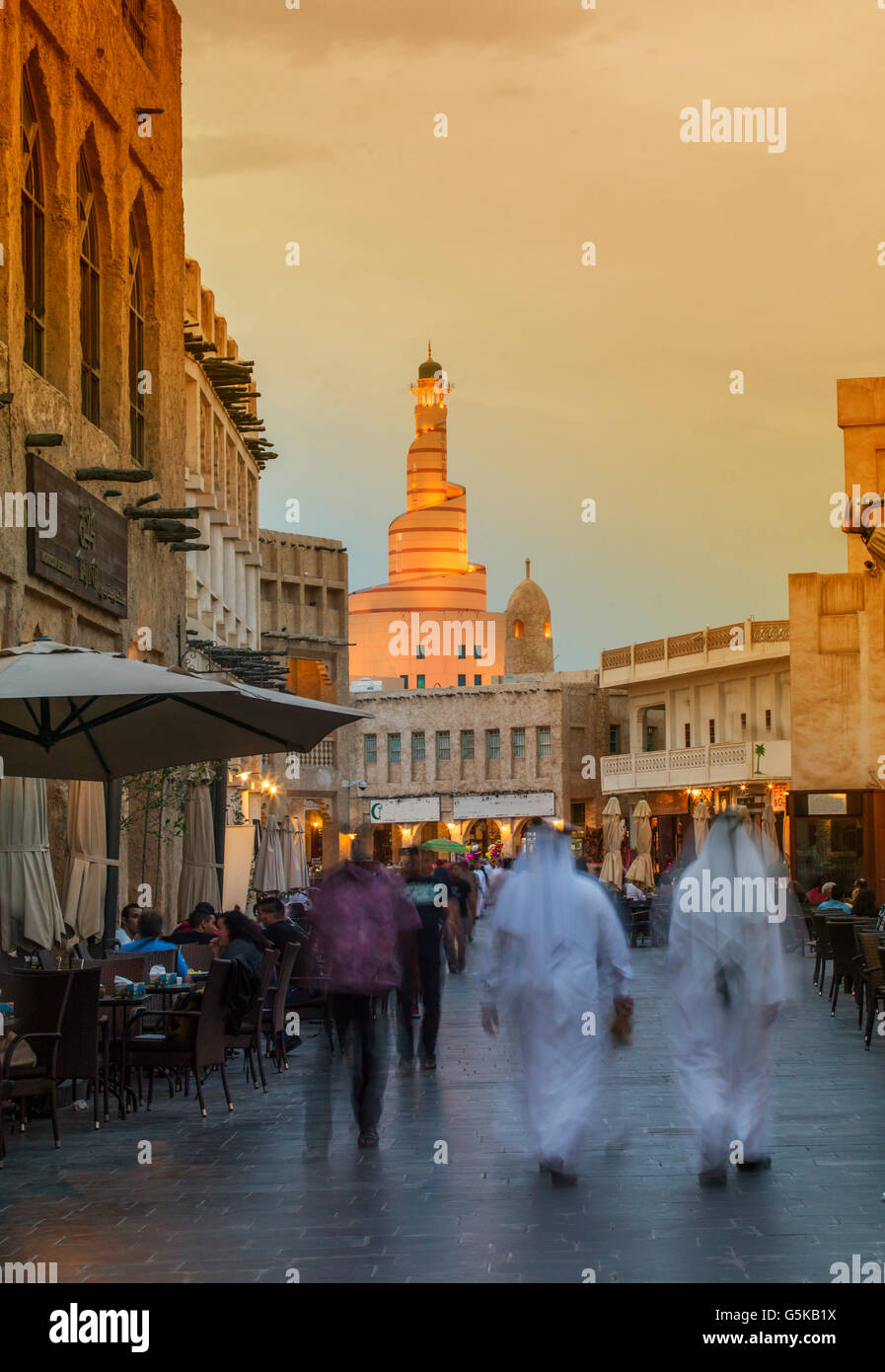 Blurred view of people walking on Doha street, Doha, Qatar Stock Photo ...