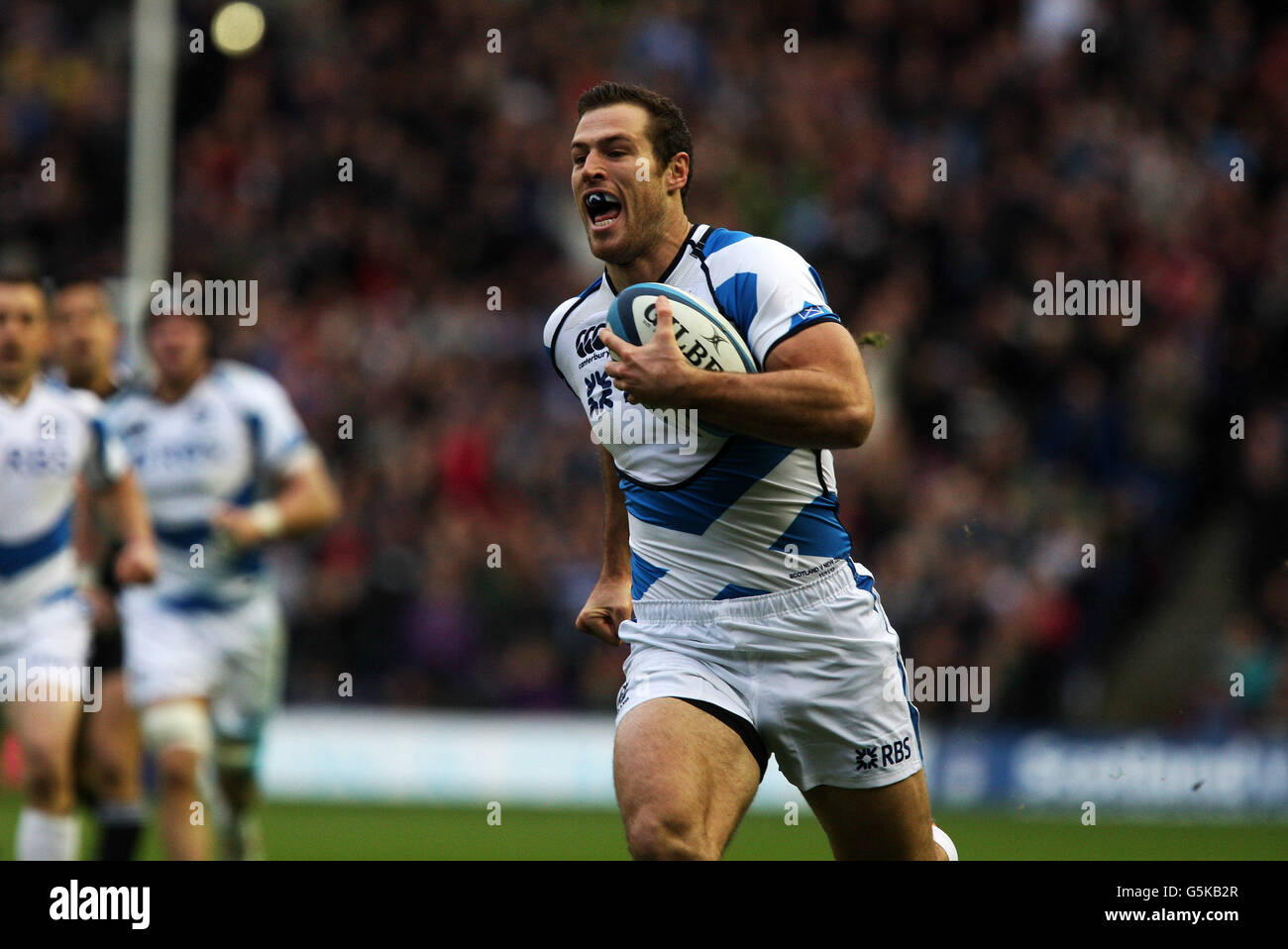 Scotland's Tim Visser runs through to score a try during the EMC Test ...