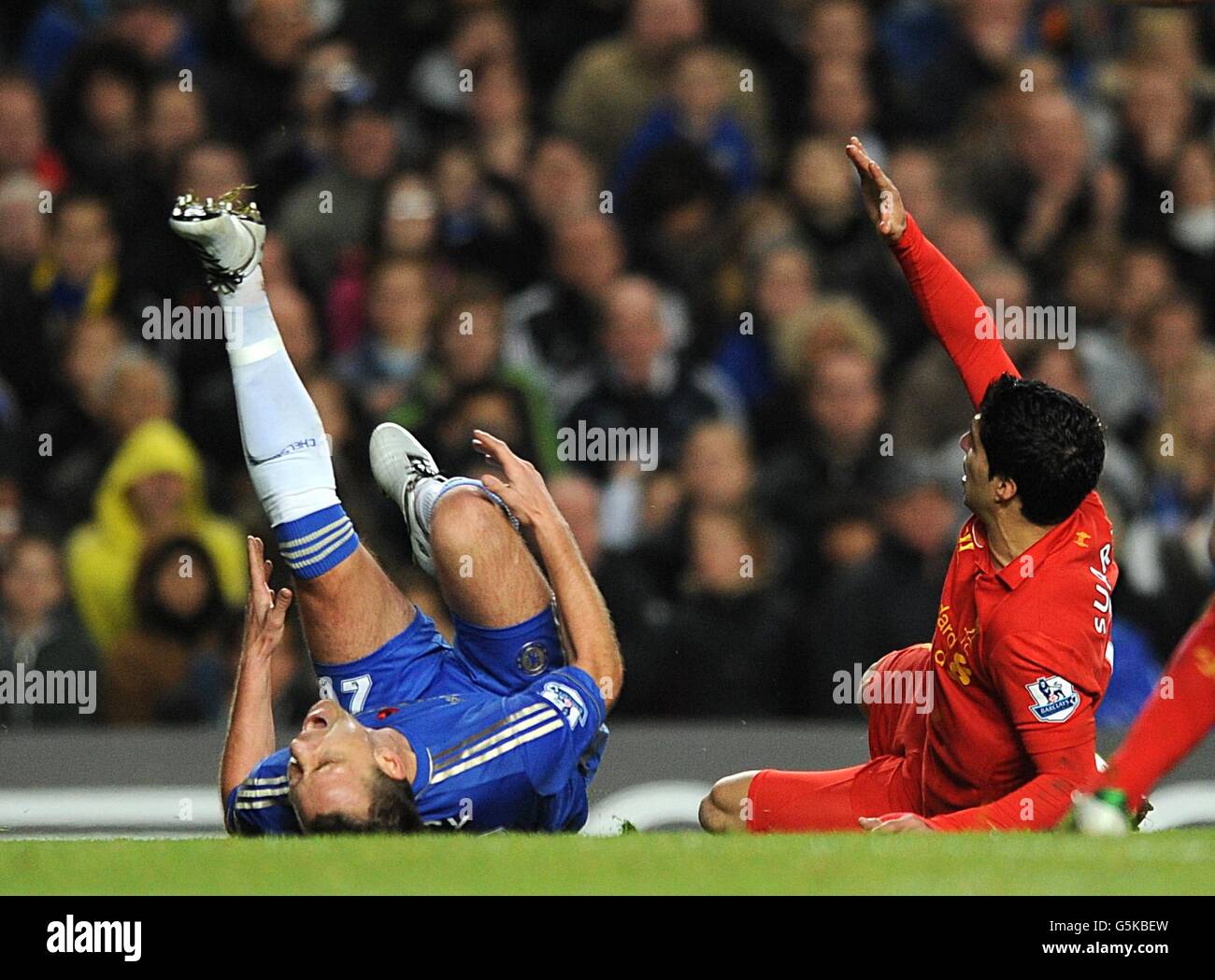 Chelsea's John Terry (left) in agony after picking up a injury in a ...