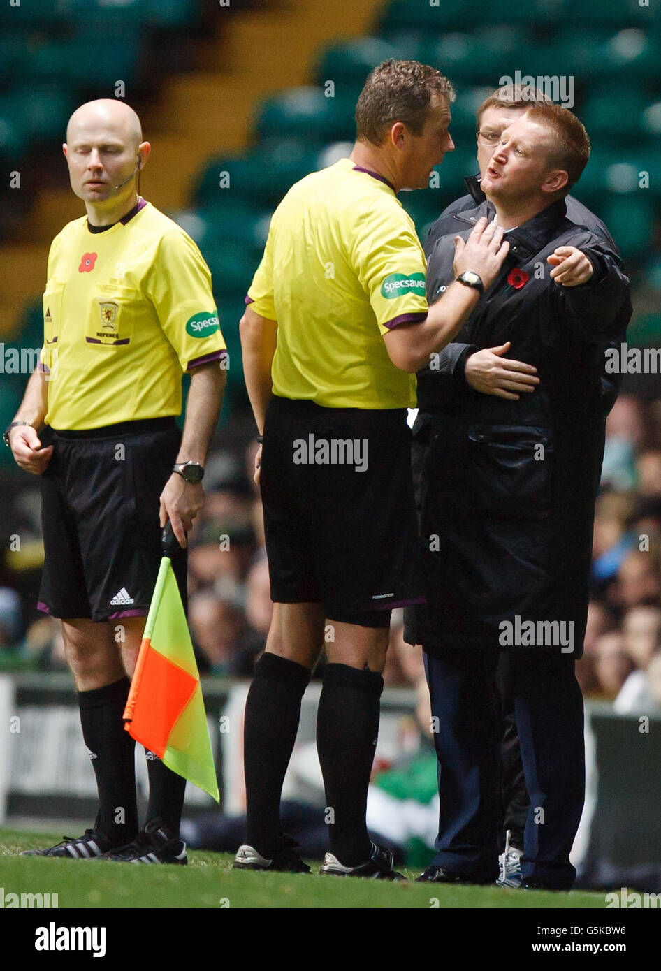 St Johnstone's manager Steve Lomas argues with match referee Iain ...
