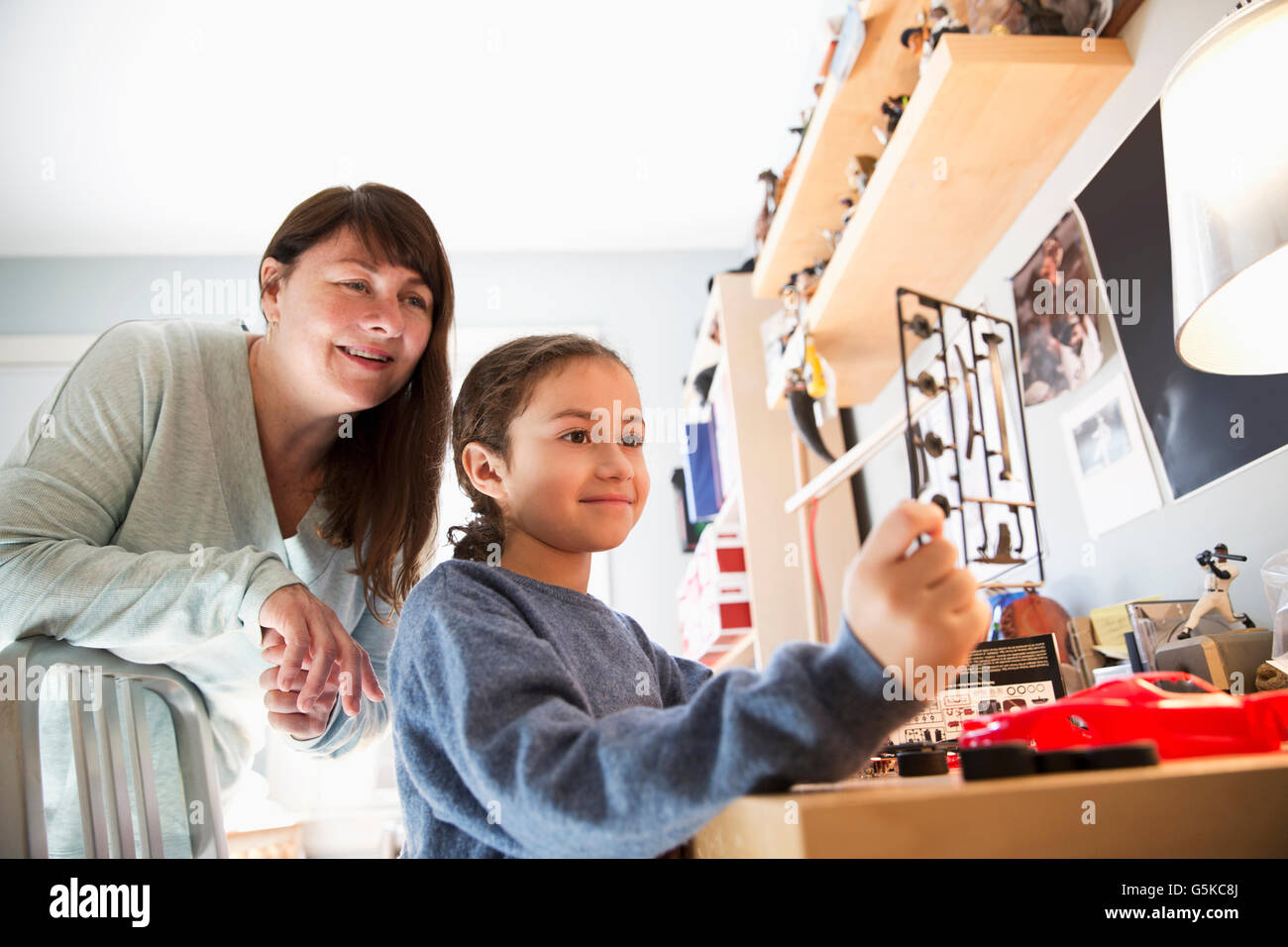 Mother and daughter building model toy Stock Photo - Alamy