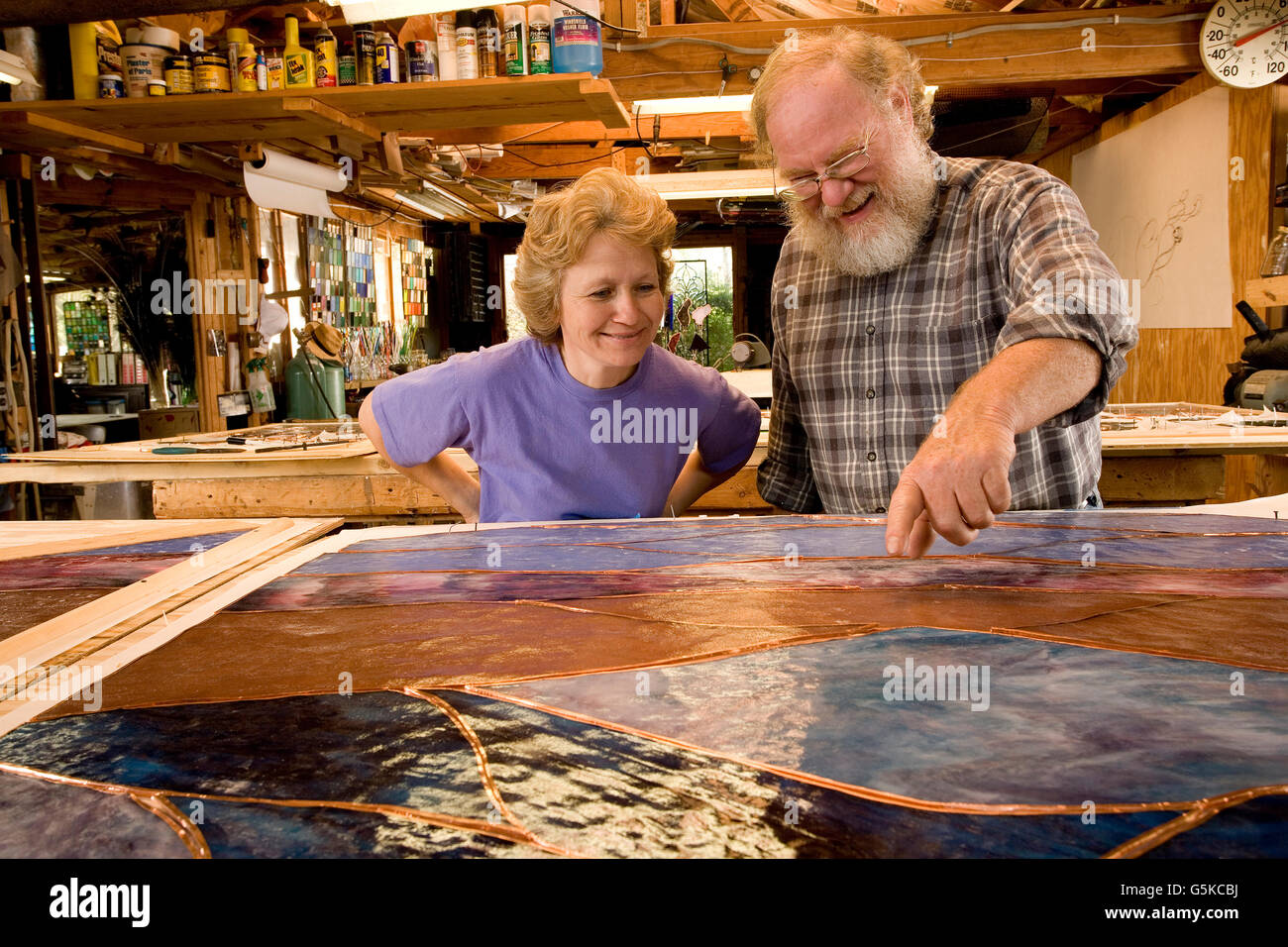 Caucasian craftspeople in workshop Stock Photo - Alamy