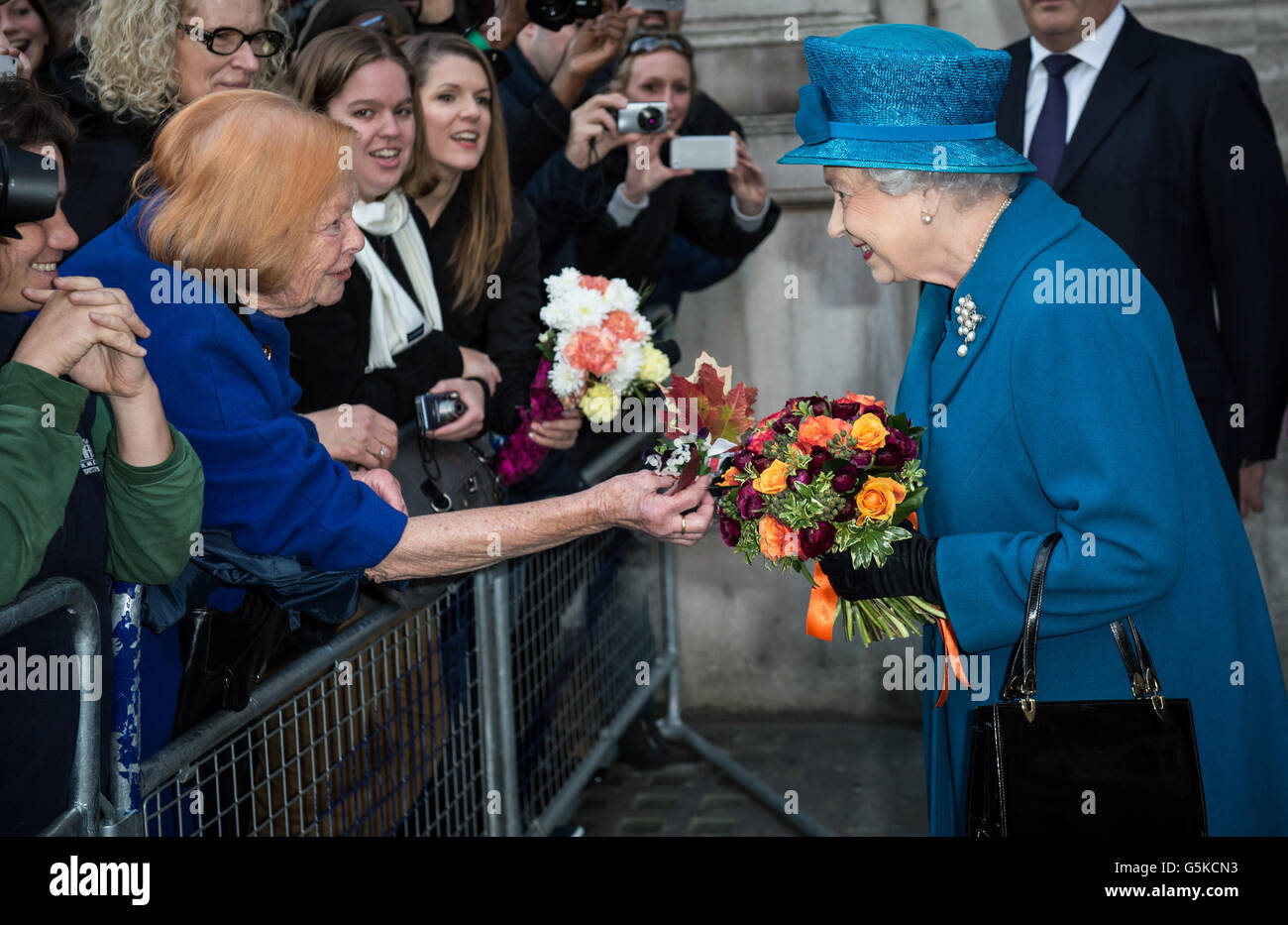 Queen Elizabeth II meets the crowd after her visit to the Royal ...