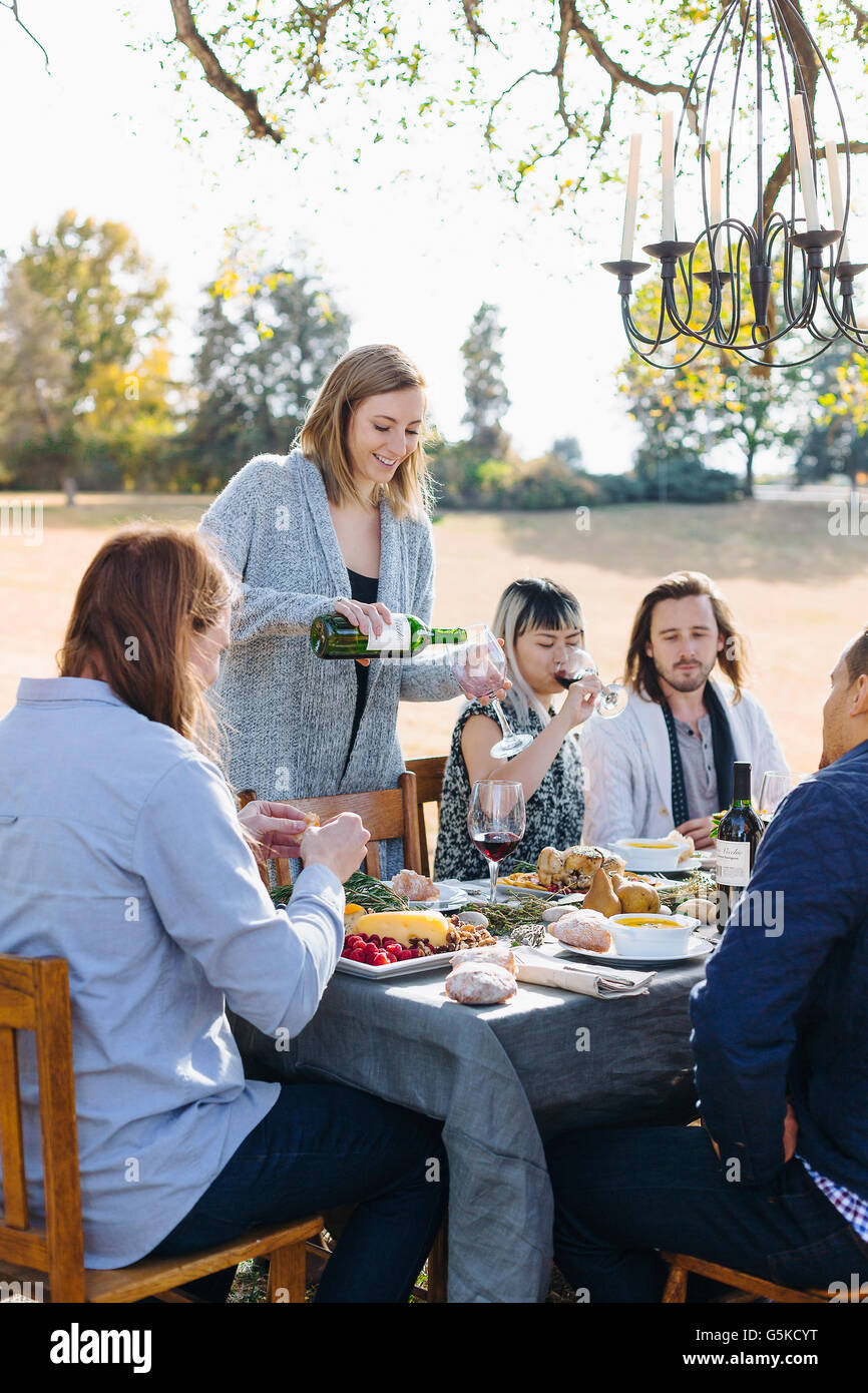 Friends eating at outdoor table Stock Photo - Alamy