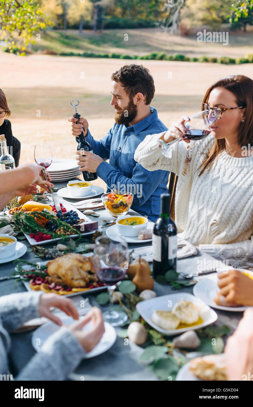 Friends eating at outdoor table Stock Photo - Alamy