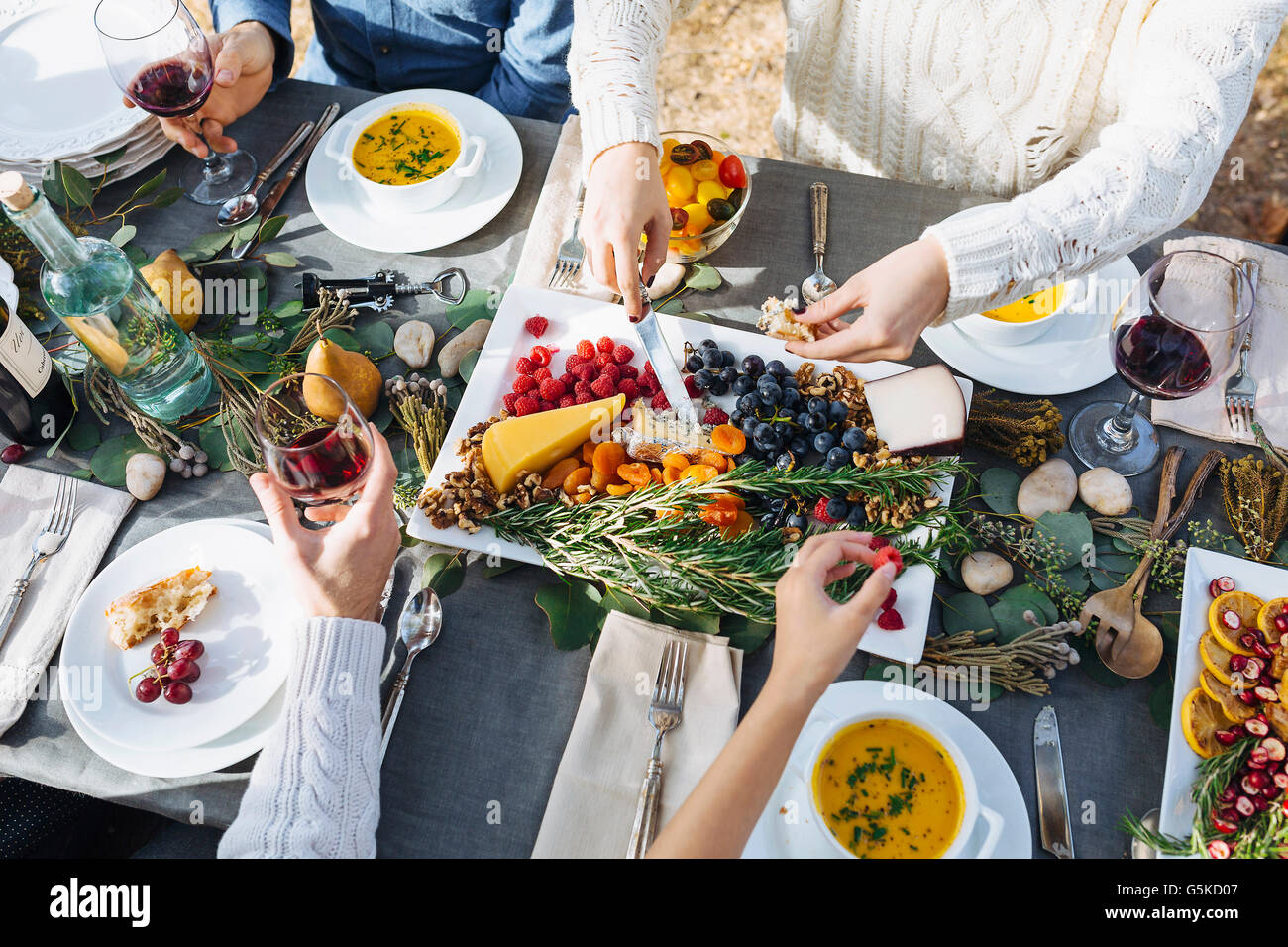 Friends eating at outdoor table Stock Photo - Alamy