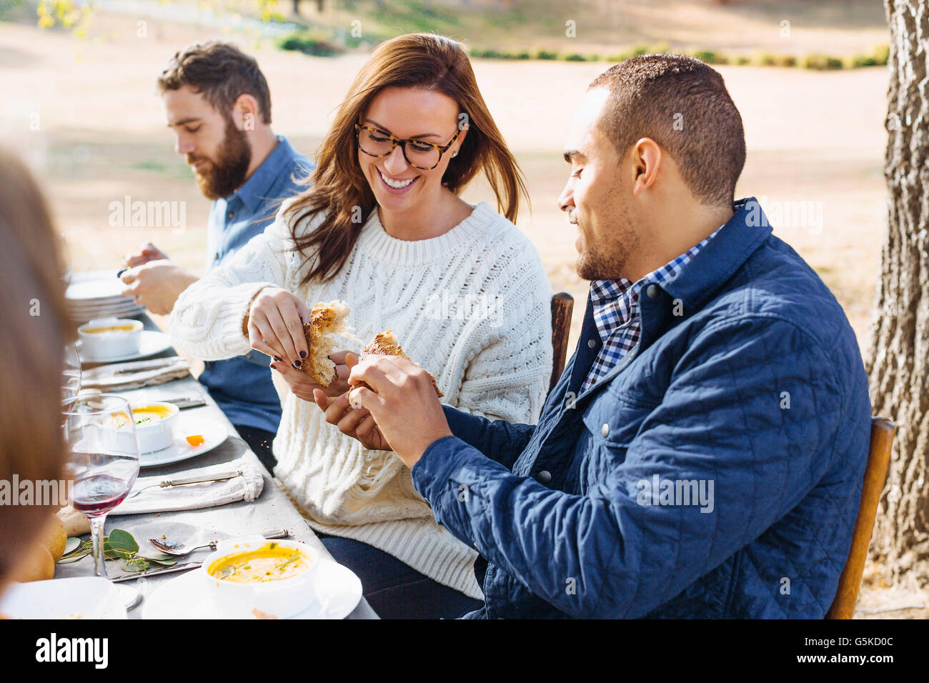 Breaking bread together hi-res stock photography and images - Alamy