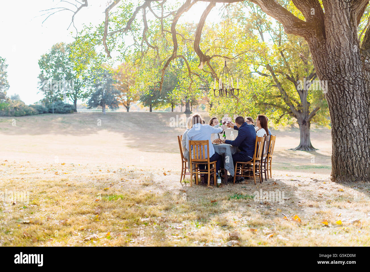 Friends eating at outdoor table Stock Photo - Alamy