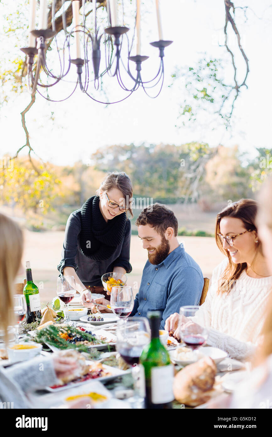 Friends eating at outdoor table Stock Photo - Alamy
