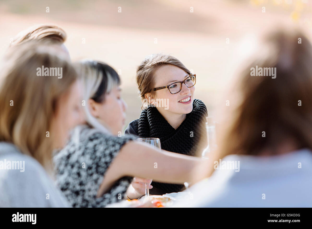 Friends eating at outdoor table Stock Photo - Alamy