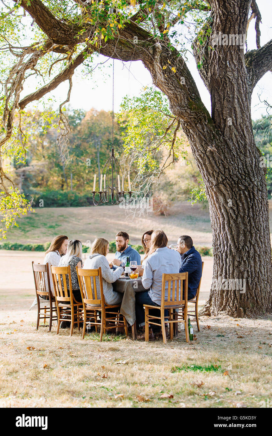 Friends eating at outdoor table Stock Photo - Alamy