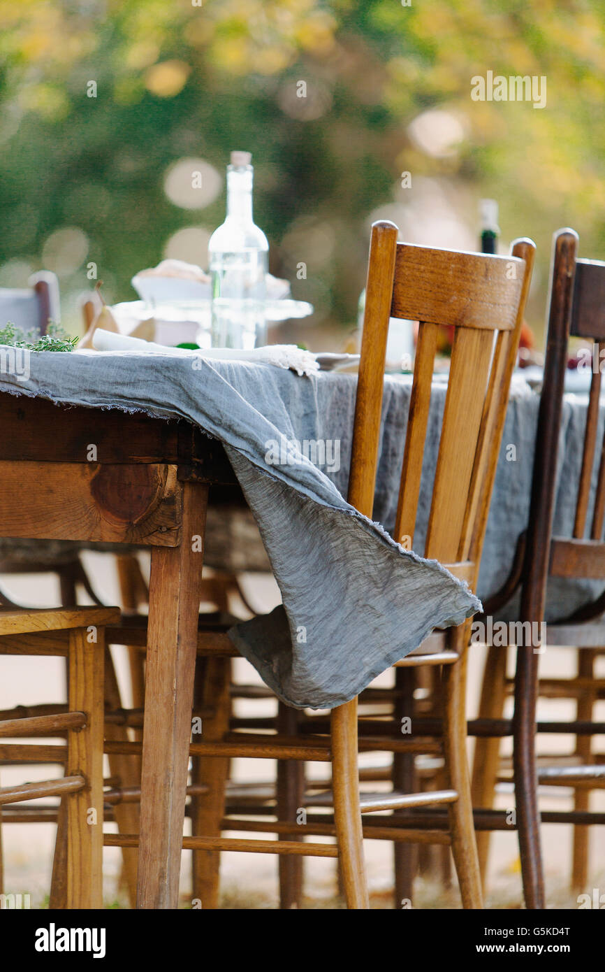 Tablecloth on empty table blowing in wind Stock Photo - Alamy