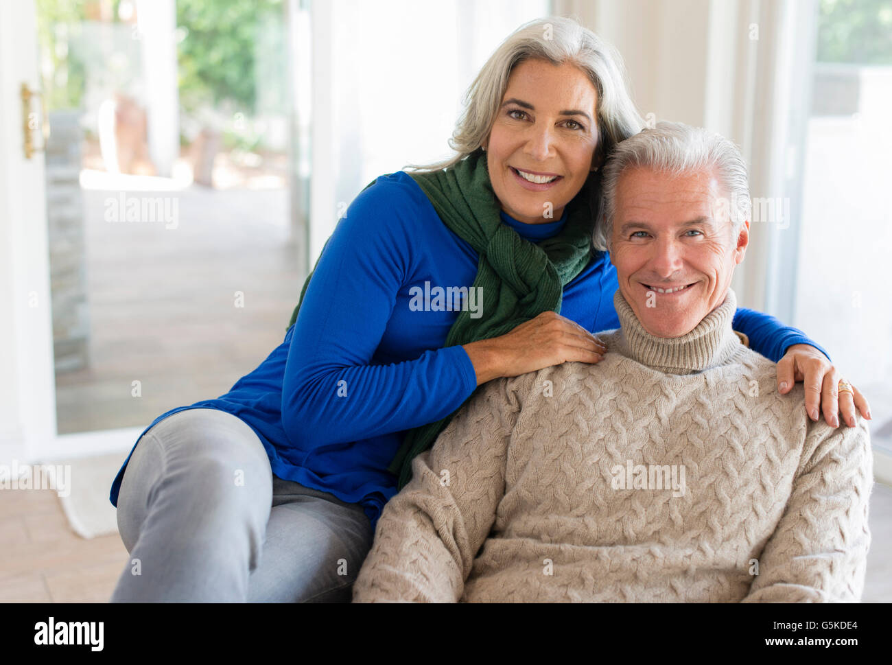 Caucasian couple hugging Stock Photo - Alamy