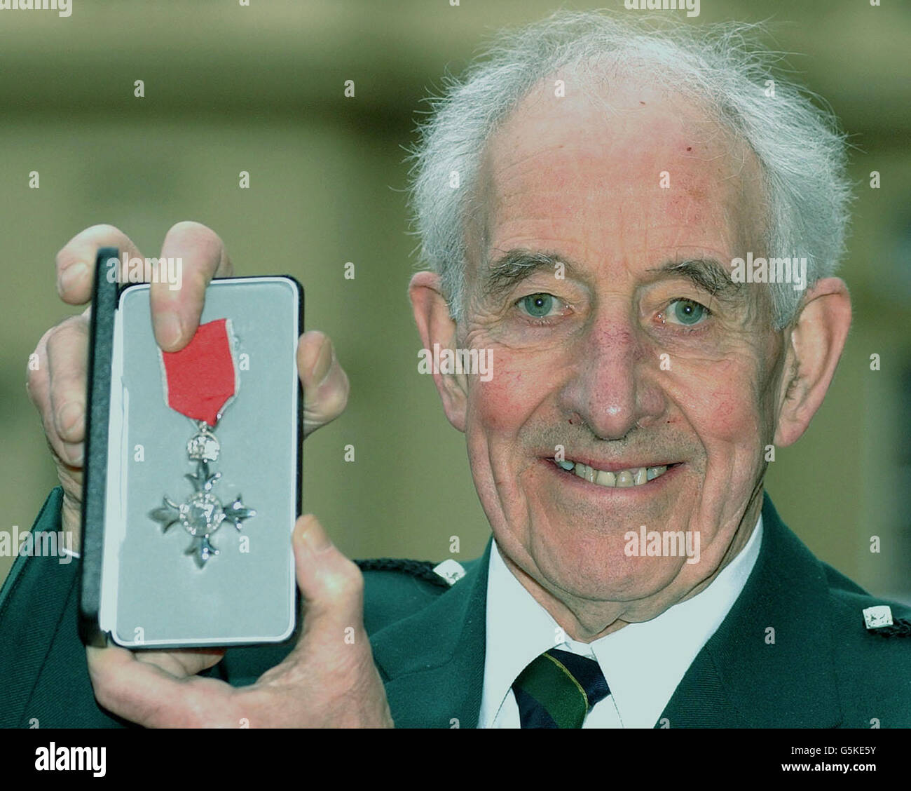 Algy Watson poses with his MBE after receiving it from Britain's Queen ...