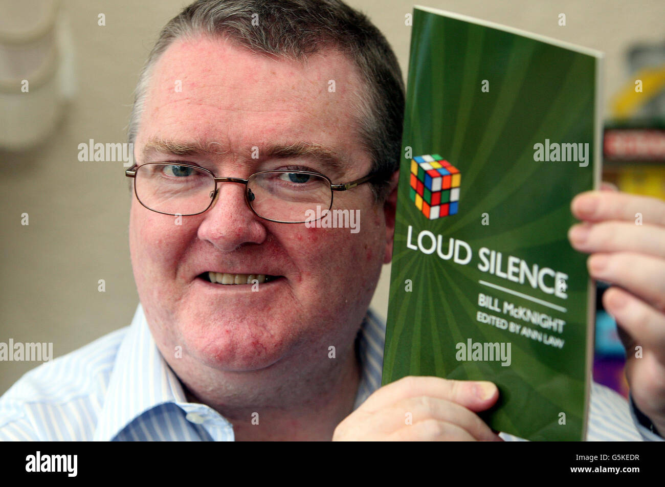 Bill McKnight, with his book of poems Loud Silence, in his Belfast home ...