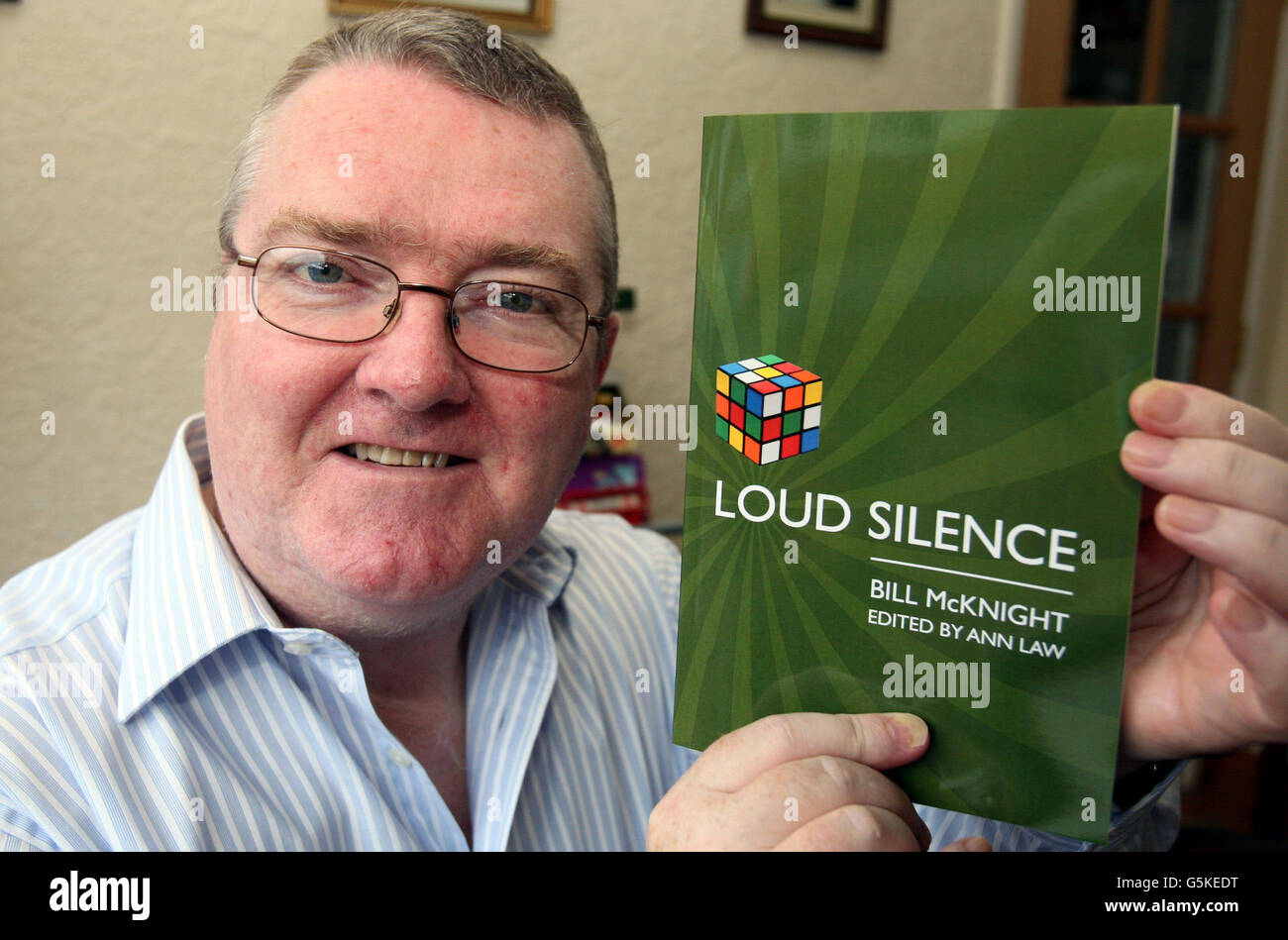 Bill McKnight, with his book of poems Loud Silence, in his Belfast home ...