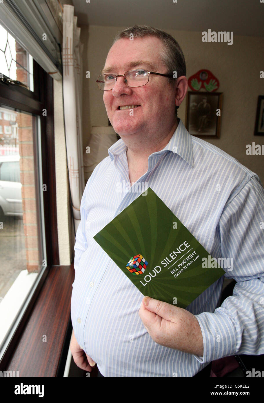 Bill McKnight, with his book of poems Loud Silence, in his Belfast home ...