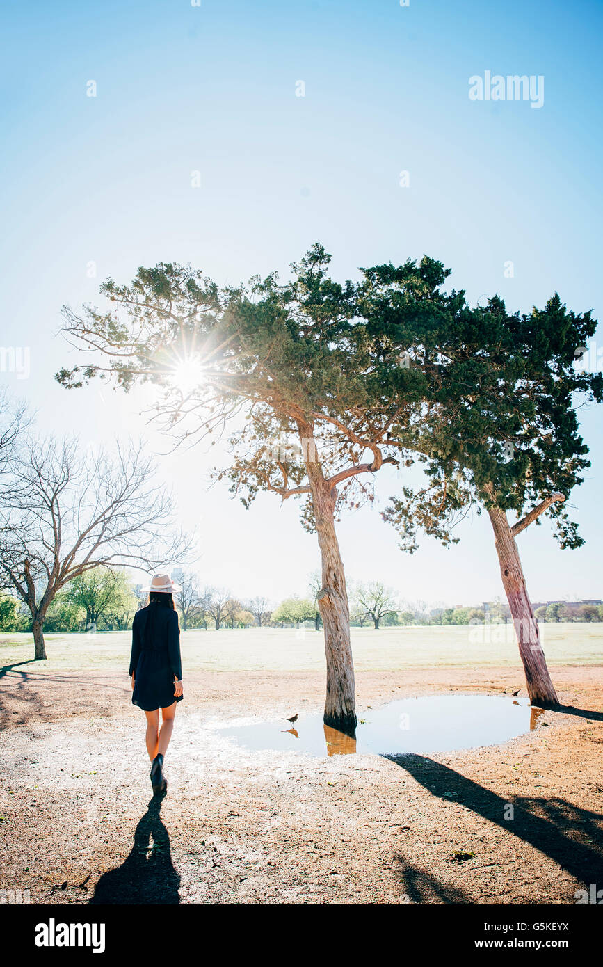 Woman walking field far hi-res stock photography and images - Alamy