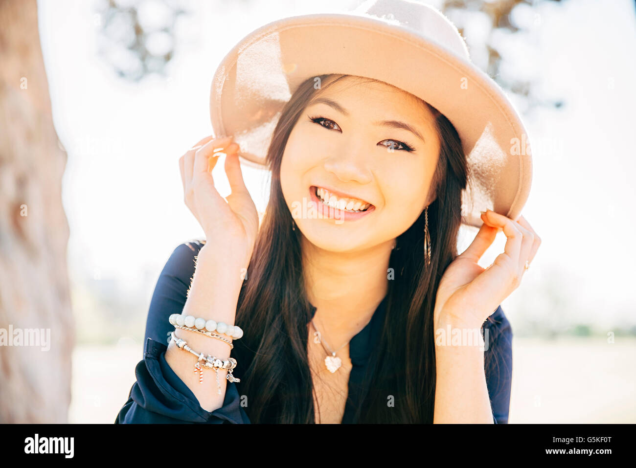 Chinese woman smiling outdoors Stock Photo - Alamy