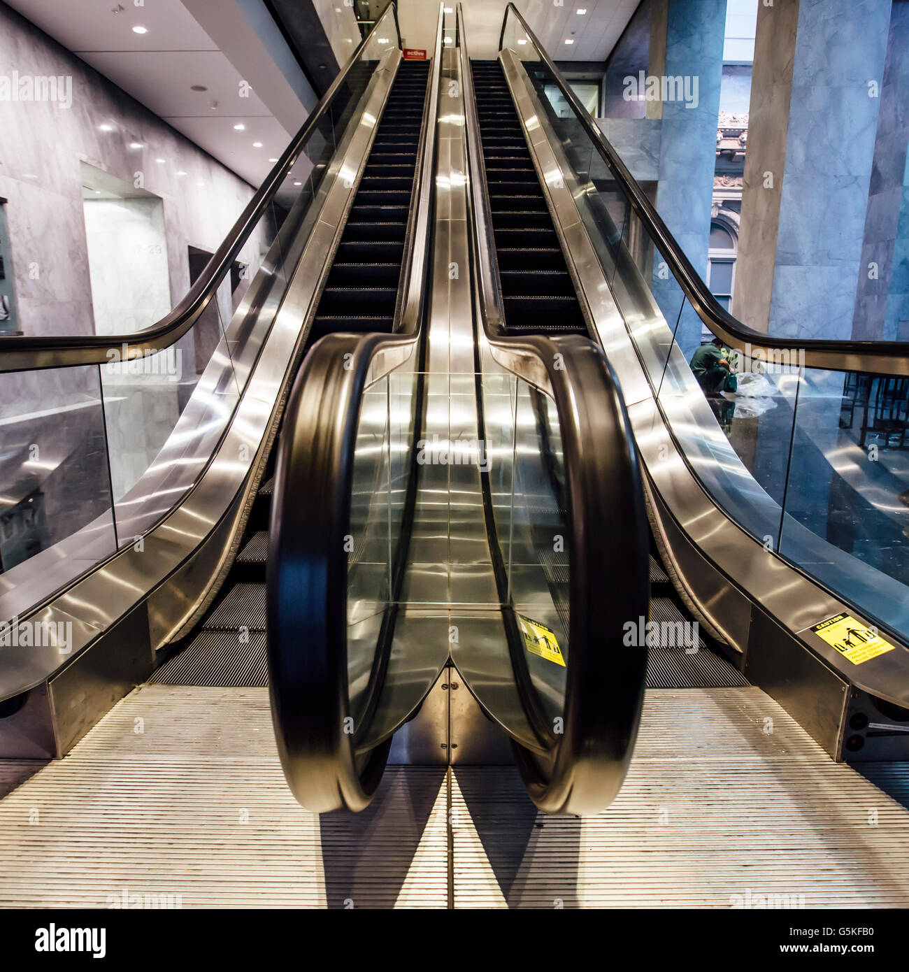 Close up of escalator handrail in office building Stock Photo - Alamy