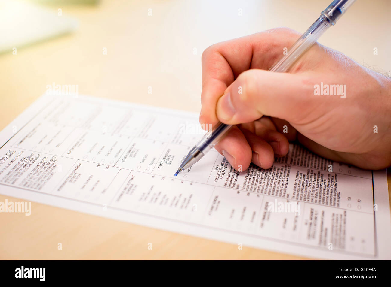 Caucasian businessman writing paperwork Stock Photo - Alamy