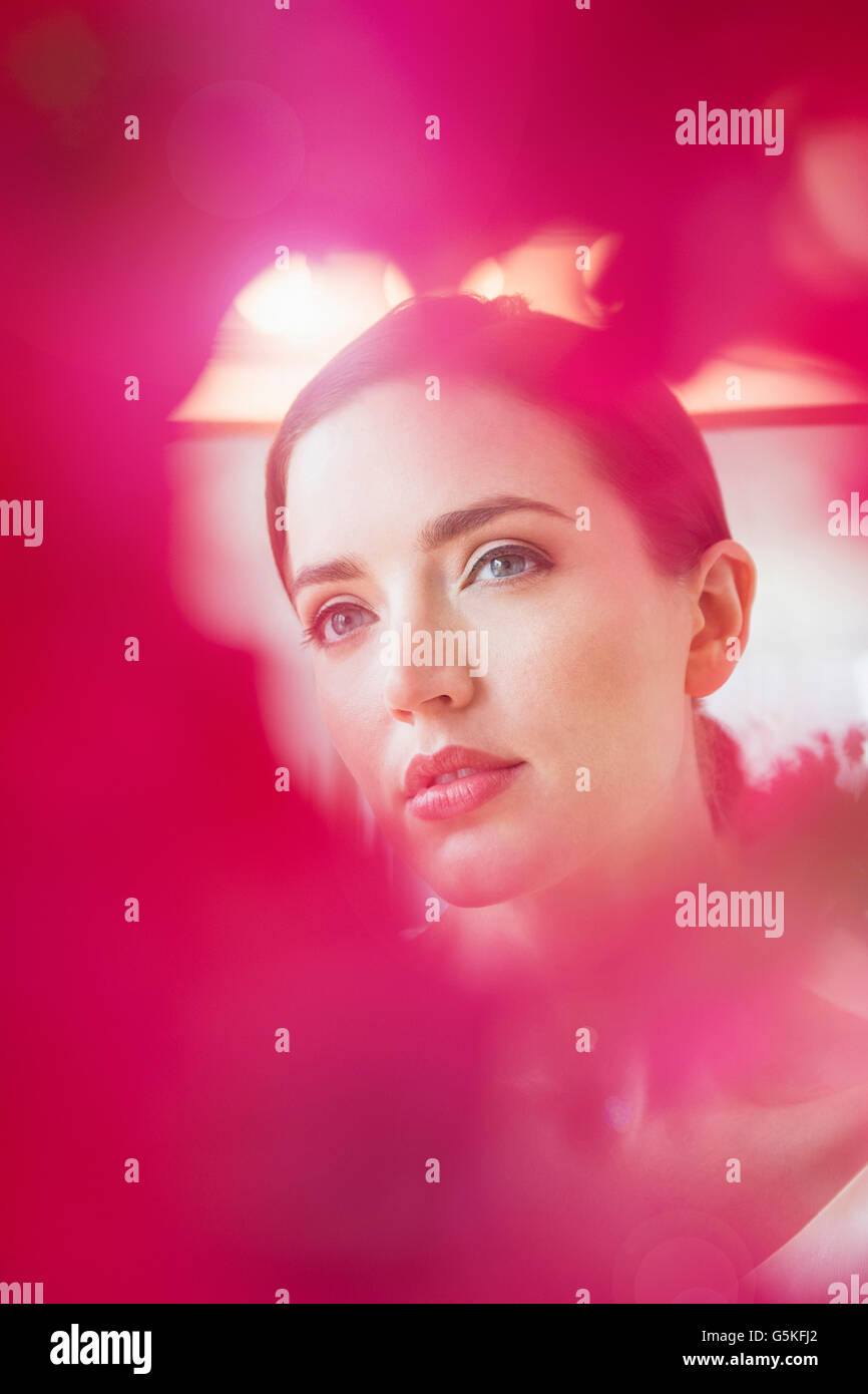 Caucasian woman obscured by flowers Stock Photo - Alamy