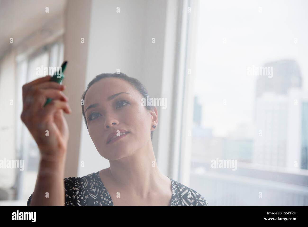 Person writing behind glass hi-res stock photography and images - Alamy