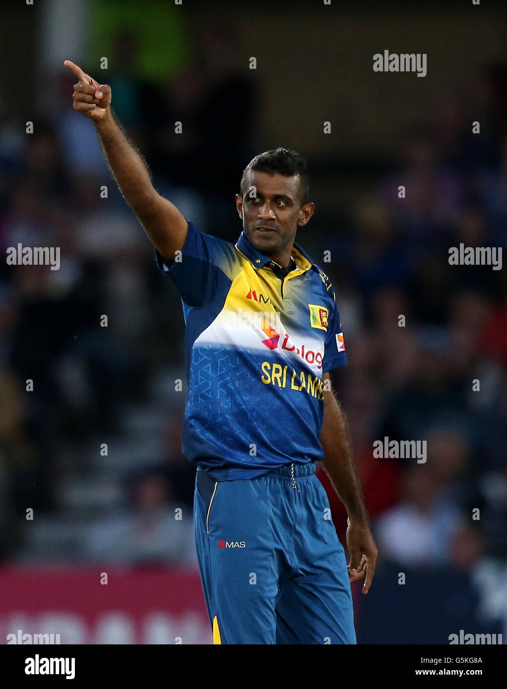 Sri Lanka's Farveez Maharoof celebrates taking the wicket of England's ...
