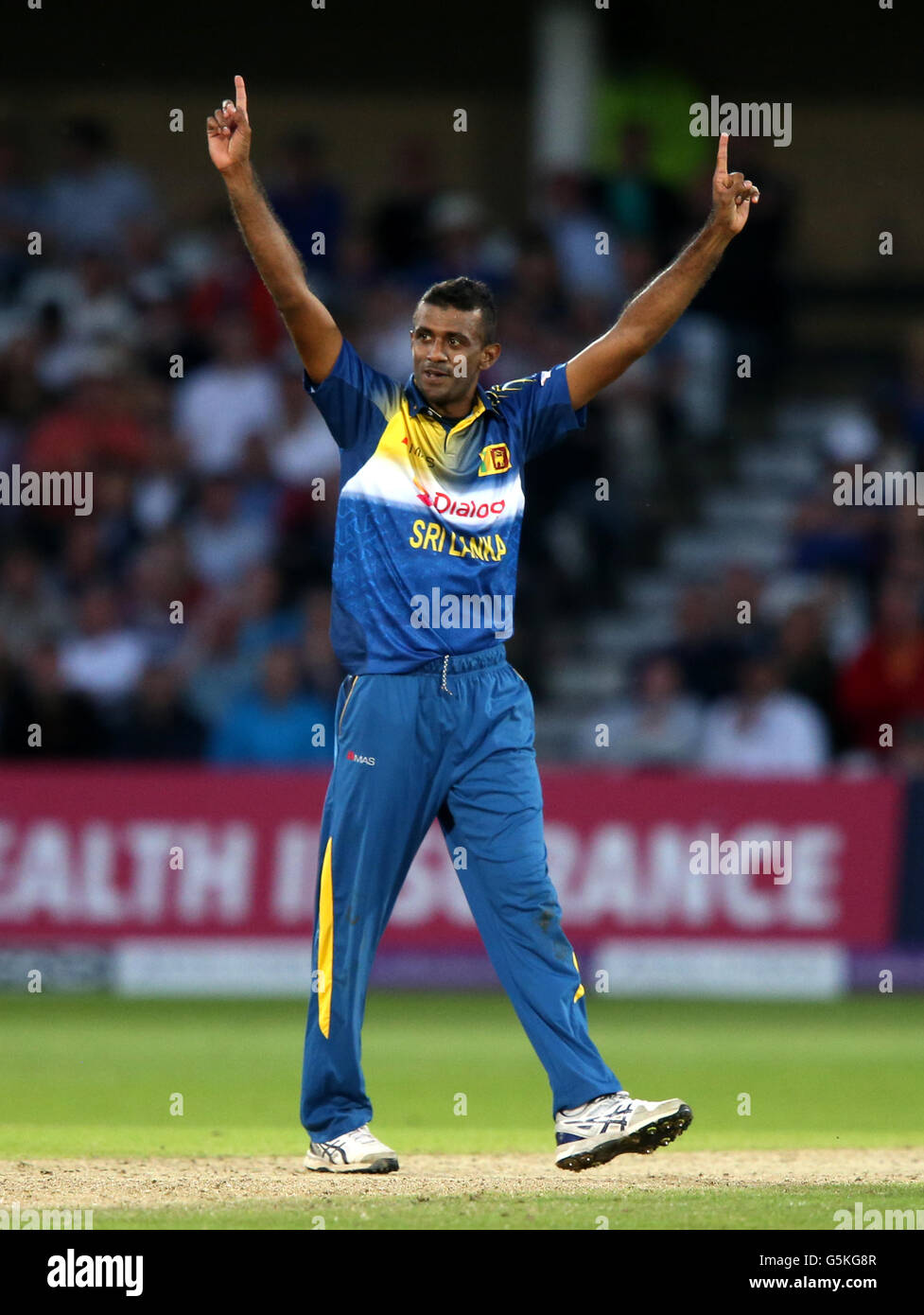 Sri Lanka's Farveez Maharoof celebrates taking the wicket of England's ...