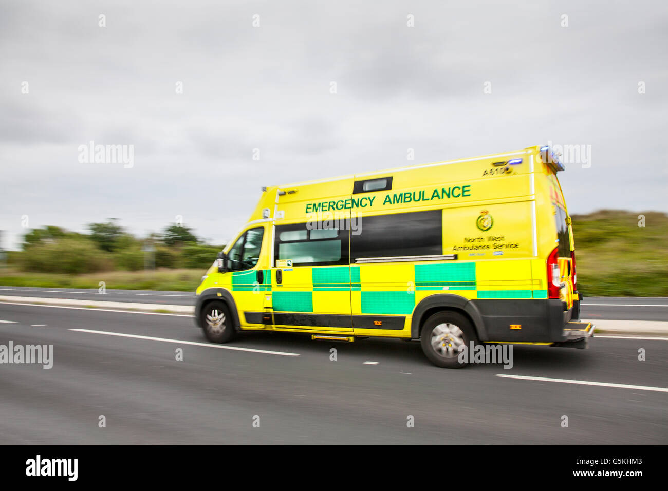 Emergency NHS Ambulance responding to incident on the Coastal Road of ...