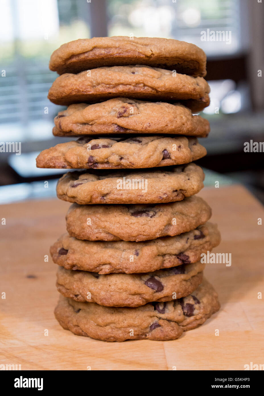 Stack of Giant Chocolate Chip Cookies on butcher block Stock Photo - Alamy