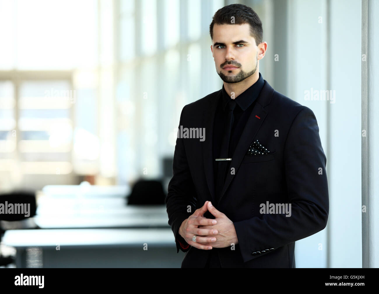 Handsome smiling confident businessman portrait Stock Photo - Alamy