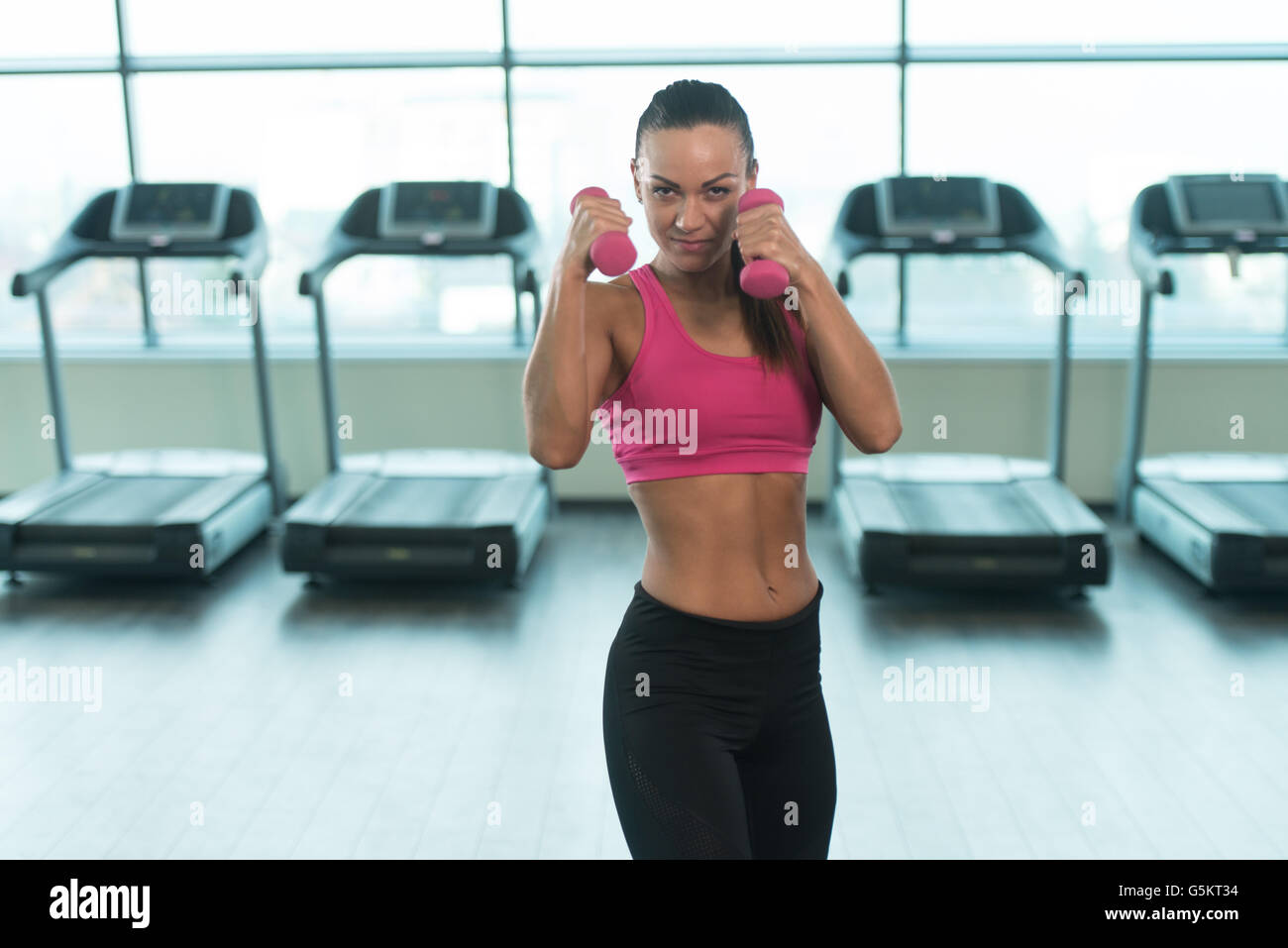 Muscular Boxer Woman MMA Fighter Practice Her Skills With Dumbbells In ...