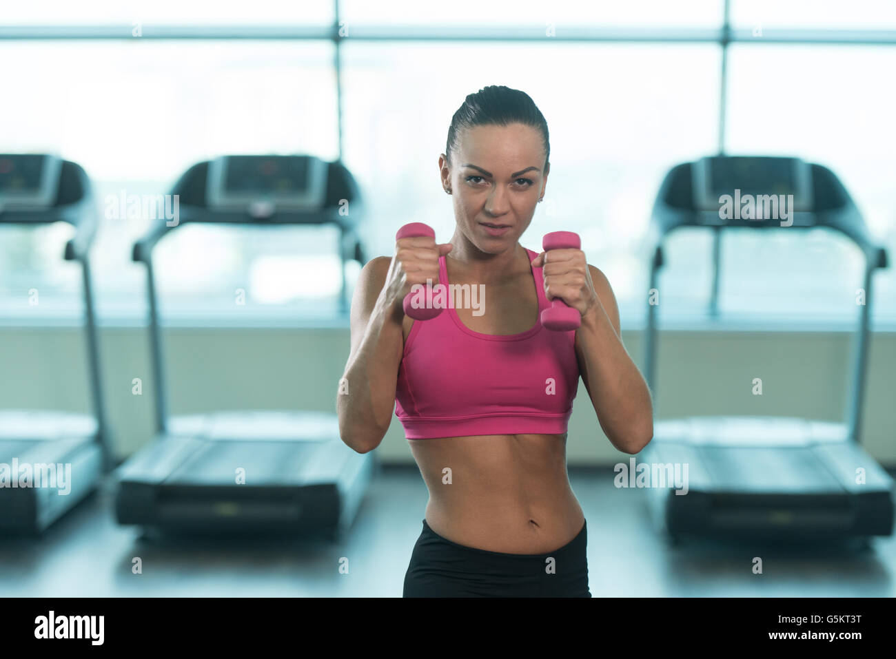 Muscular Boxer Woman MMA Fighter Practice Her Skills With Dumbbells In ...