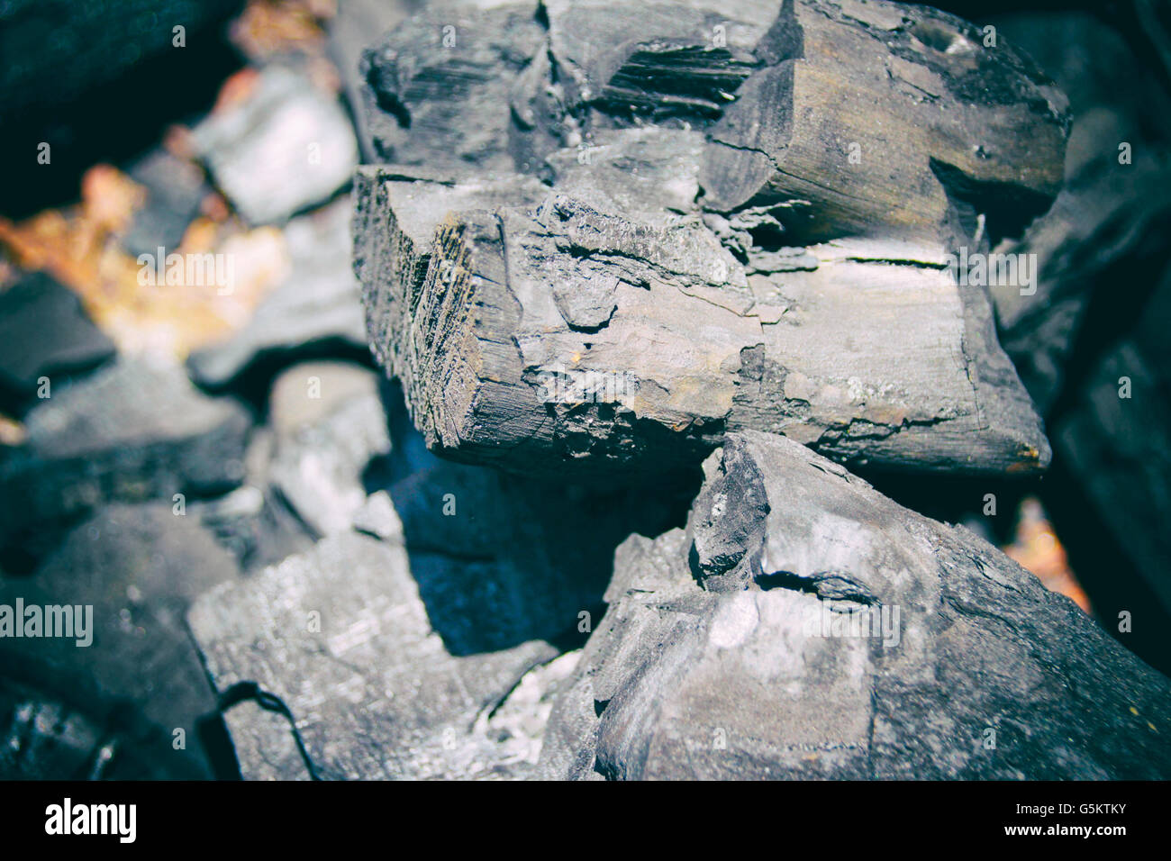 Photograph of some wood charcoal pieces and fire flames Stock Photo - Alamy