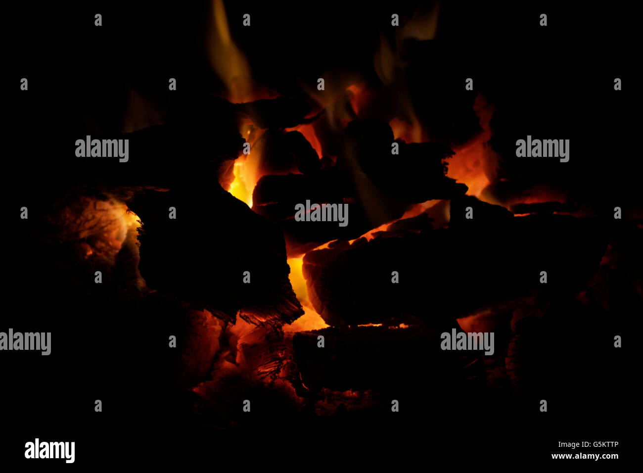 Photograph of charcoal pieces and fire flames Stock Photo - Alamy