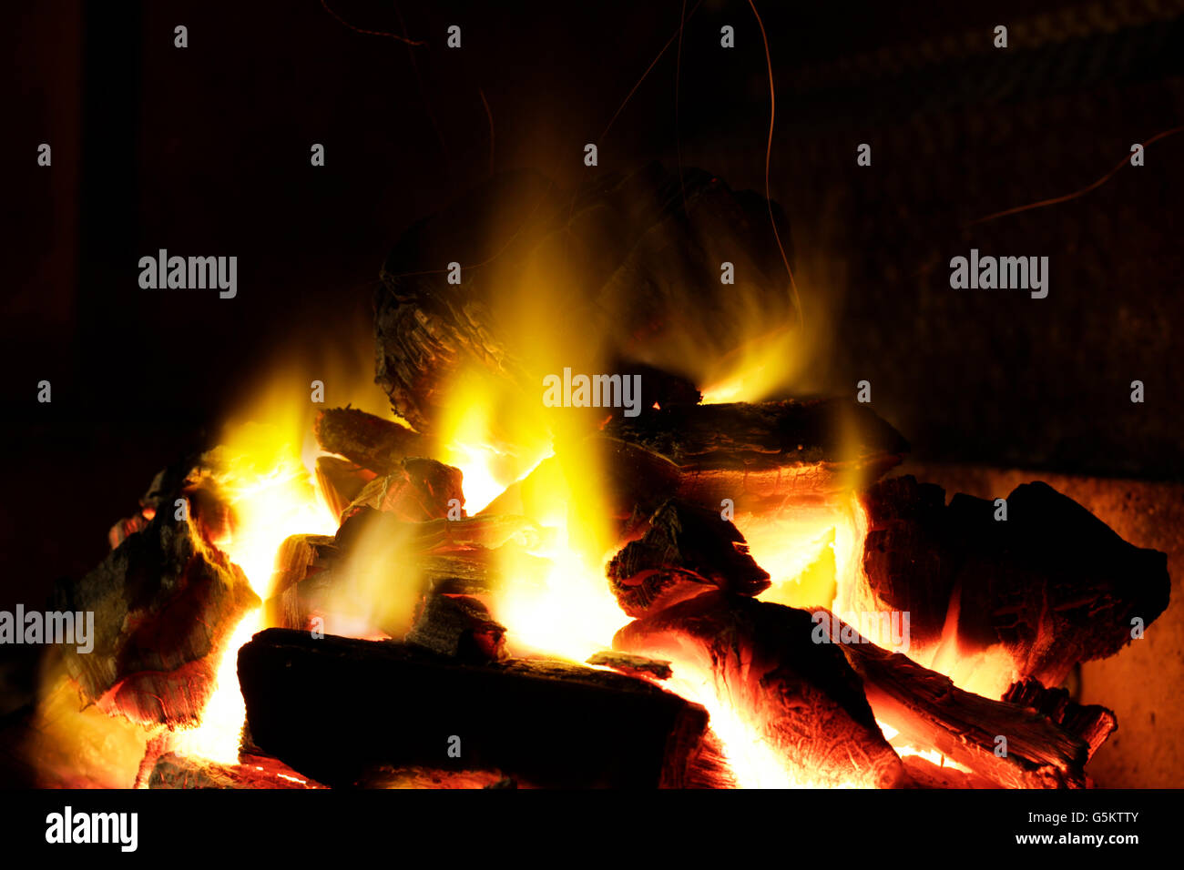 Photograph of charcoal pieces and fire flames Stock Photo - Alamy