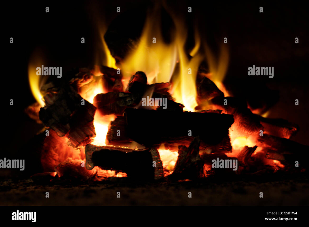 Photograph of charcoal pieces and fire flames Stock Photo - Alamy