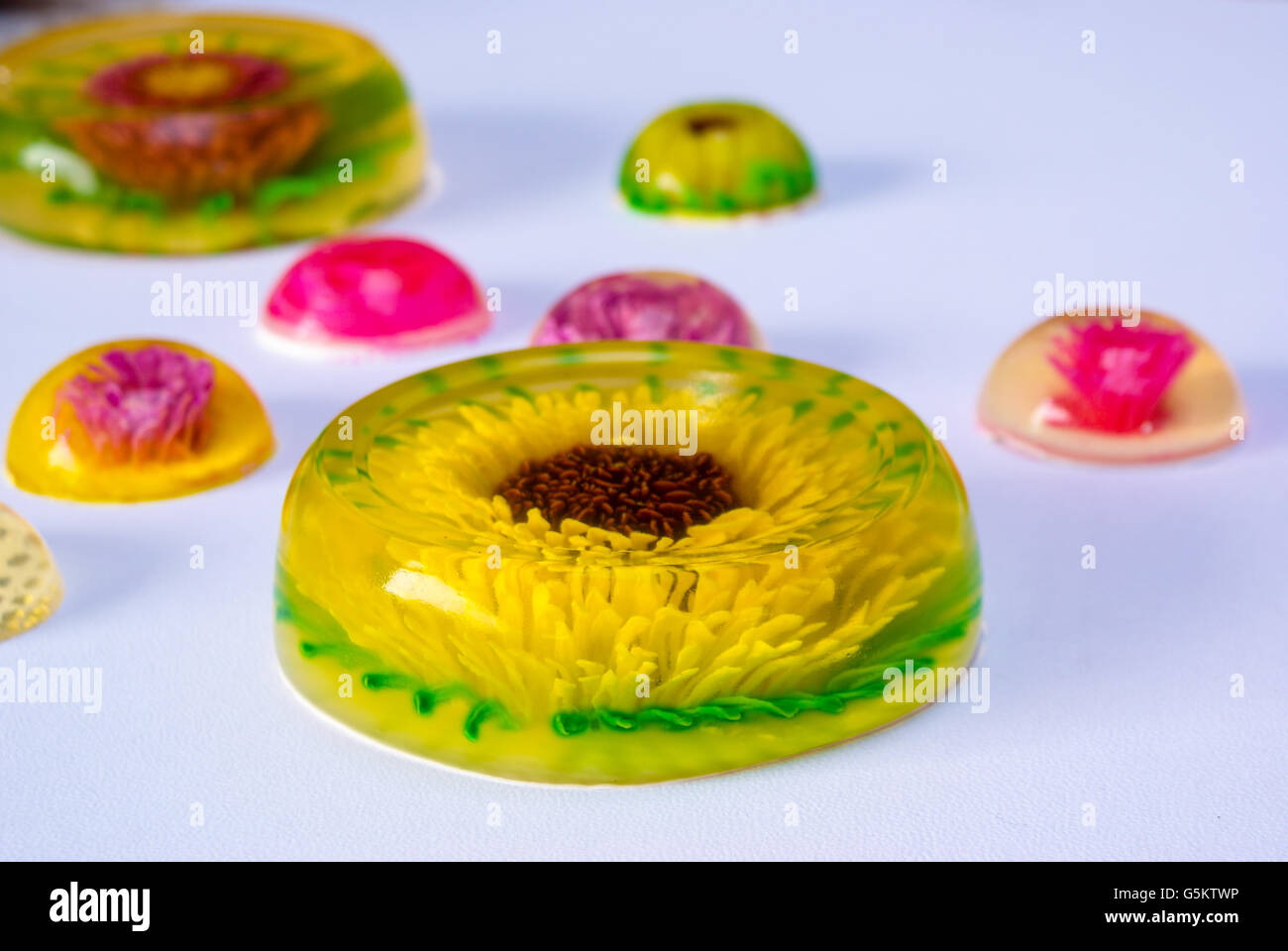 Photograph of some colorful jelly spheres with flowers Stock Photo - Alamy
