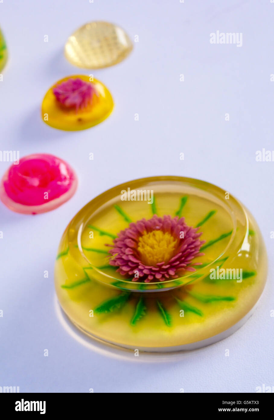 Photograph of some colorful jelly spheres with flowers Stock Photo - Alamy