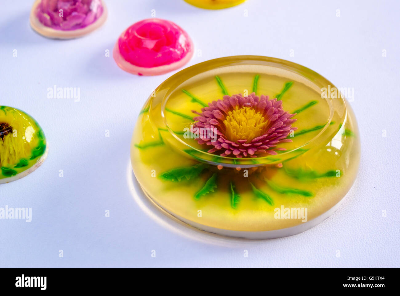 Photograph of some colorful jelly spheres with flowers Stock Photo - Alamy