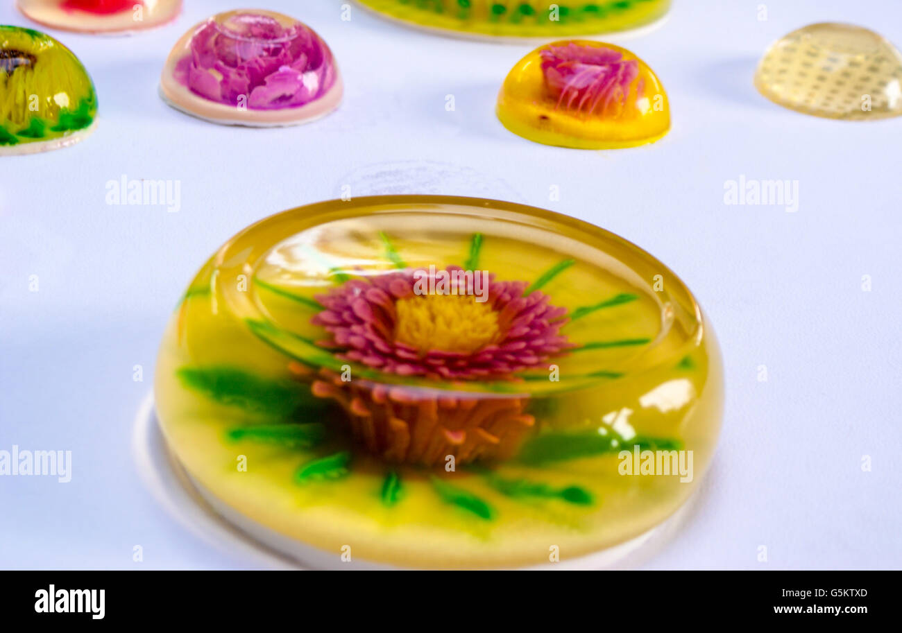Photograph of some colorful jelly spheres with flowers Stock Photo - Alamy