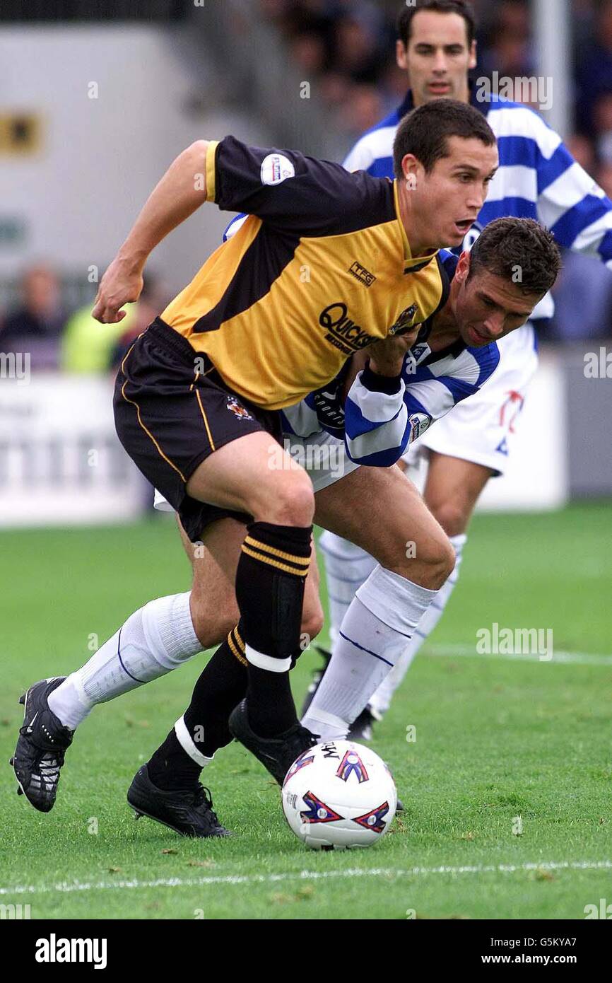 Cambridge's Richard Prokas (front) carves through the QPR defence ...