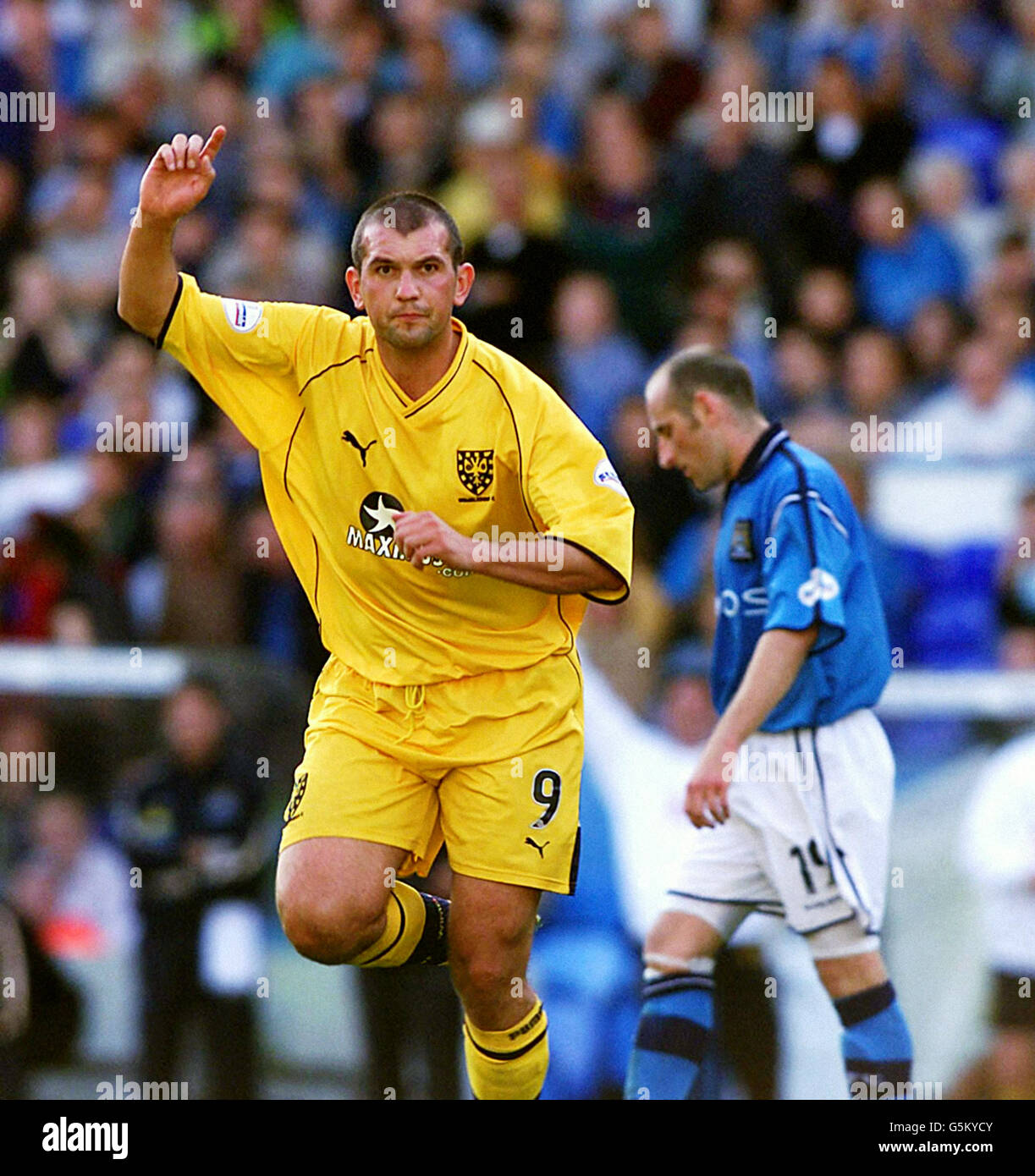 Wimbledon's Neil Shipperley celebrates scoring the first of his two ...