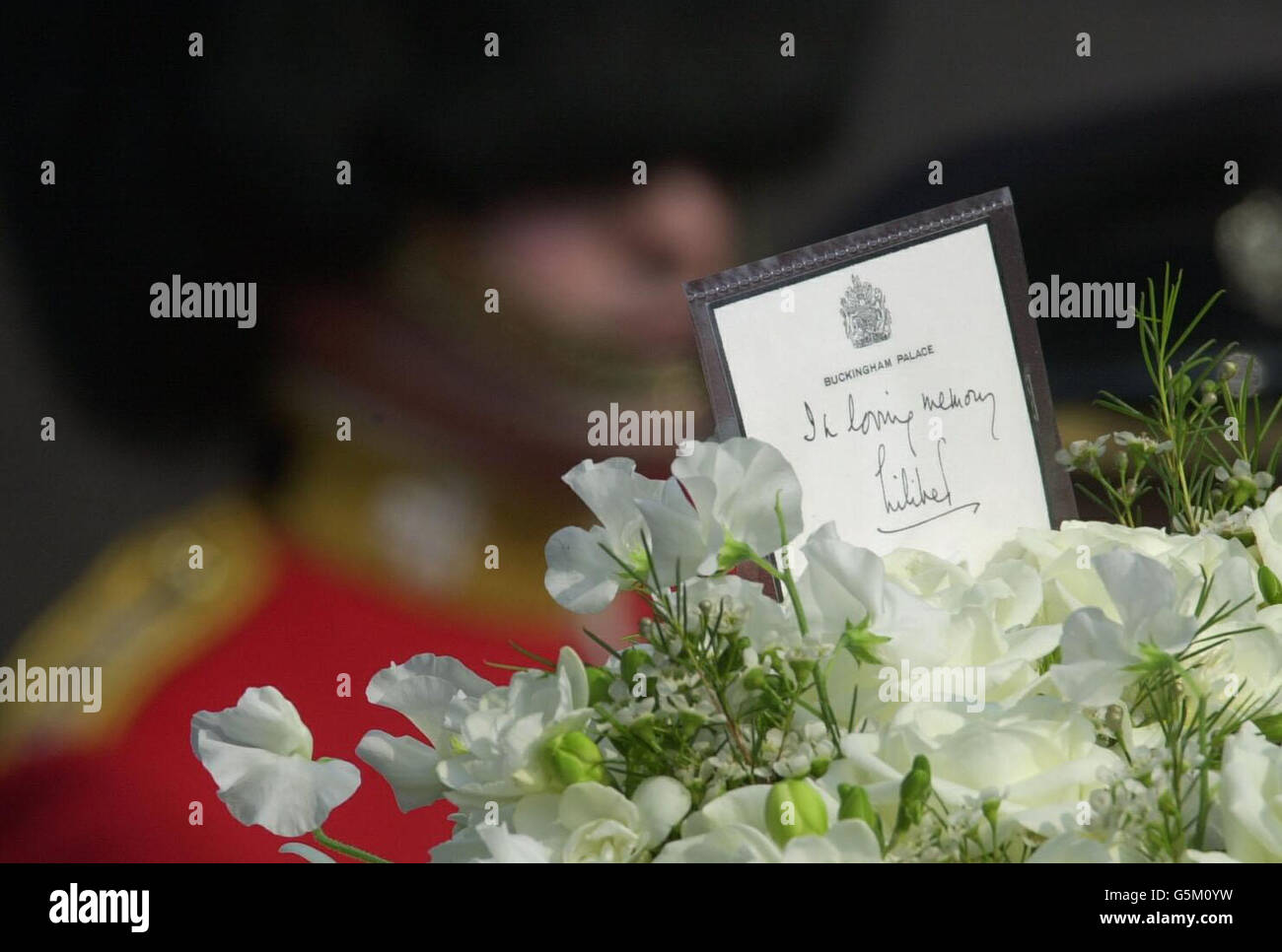 A message from Britain's Queen Elizabeth II sits on top of the coffin ...