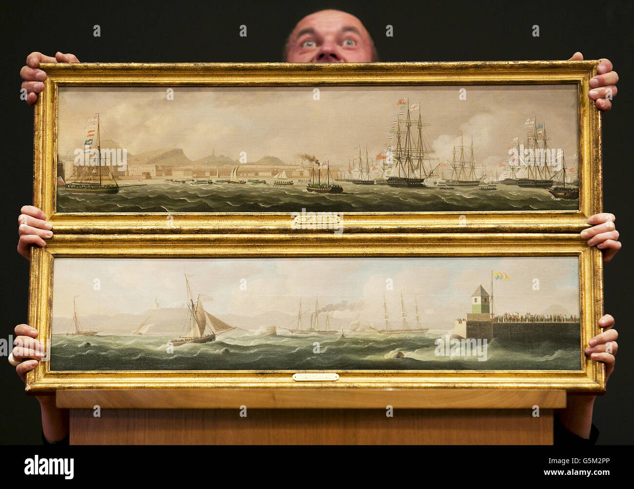 Lyon and Turnbull's Philip Gregory looks above two paintings by Thomas ...